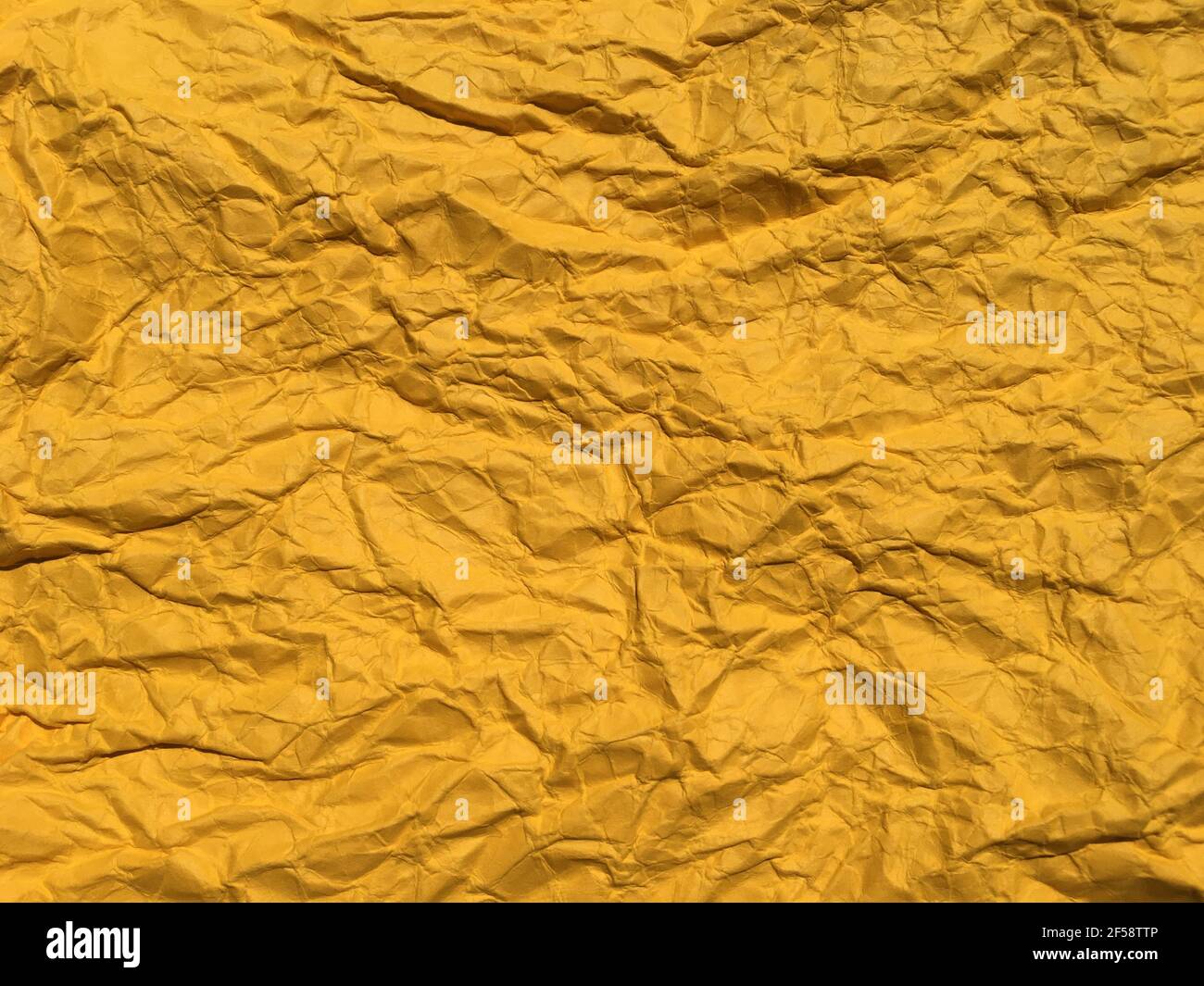Yellow wrinkled paper background for Design. Copy space for text or ...