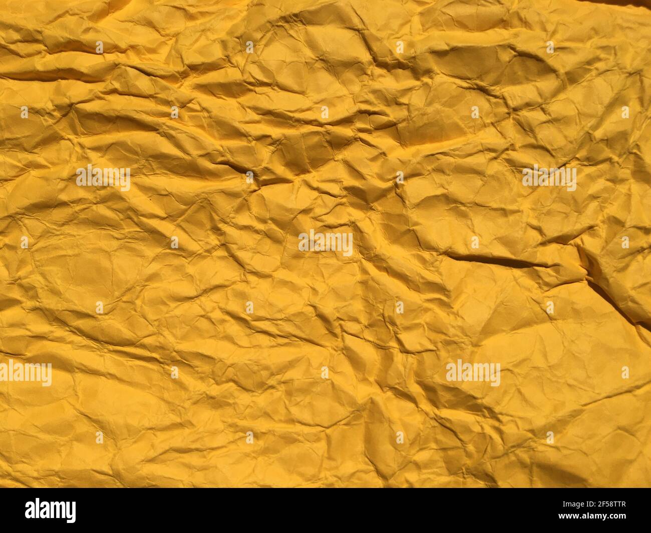 Yellow wrinkled paper background for Design. Copy space for text or ...