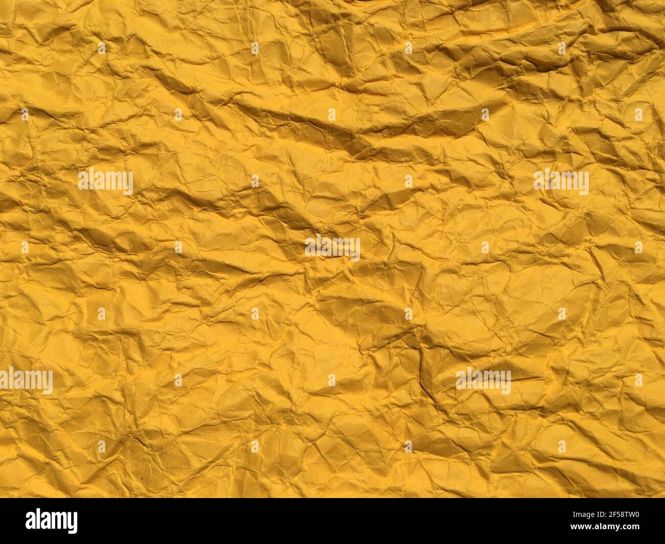 Yellow wrinkled paper background for Design. Copy space for text or ...