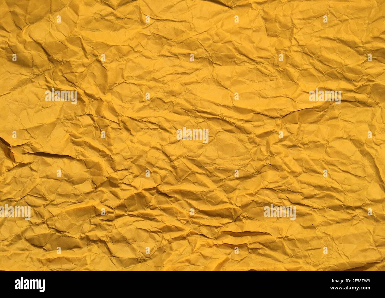 Yellow wrinkled paper background for Design. Copy space for text or ...