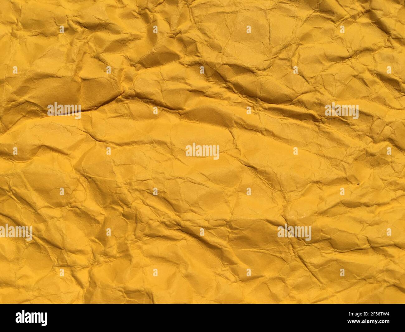 Yellow wrinkled paper background for Design. Copy space for text or ...