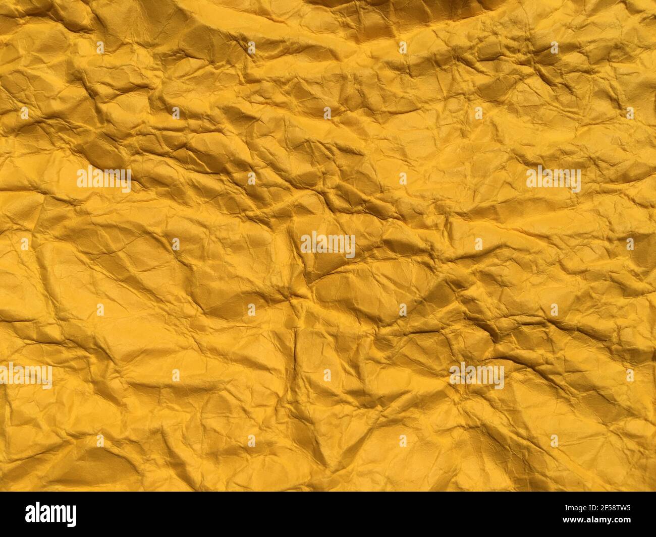 Yellow wrinkled paper background for Design. Copy space for text or ...