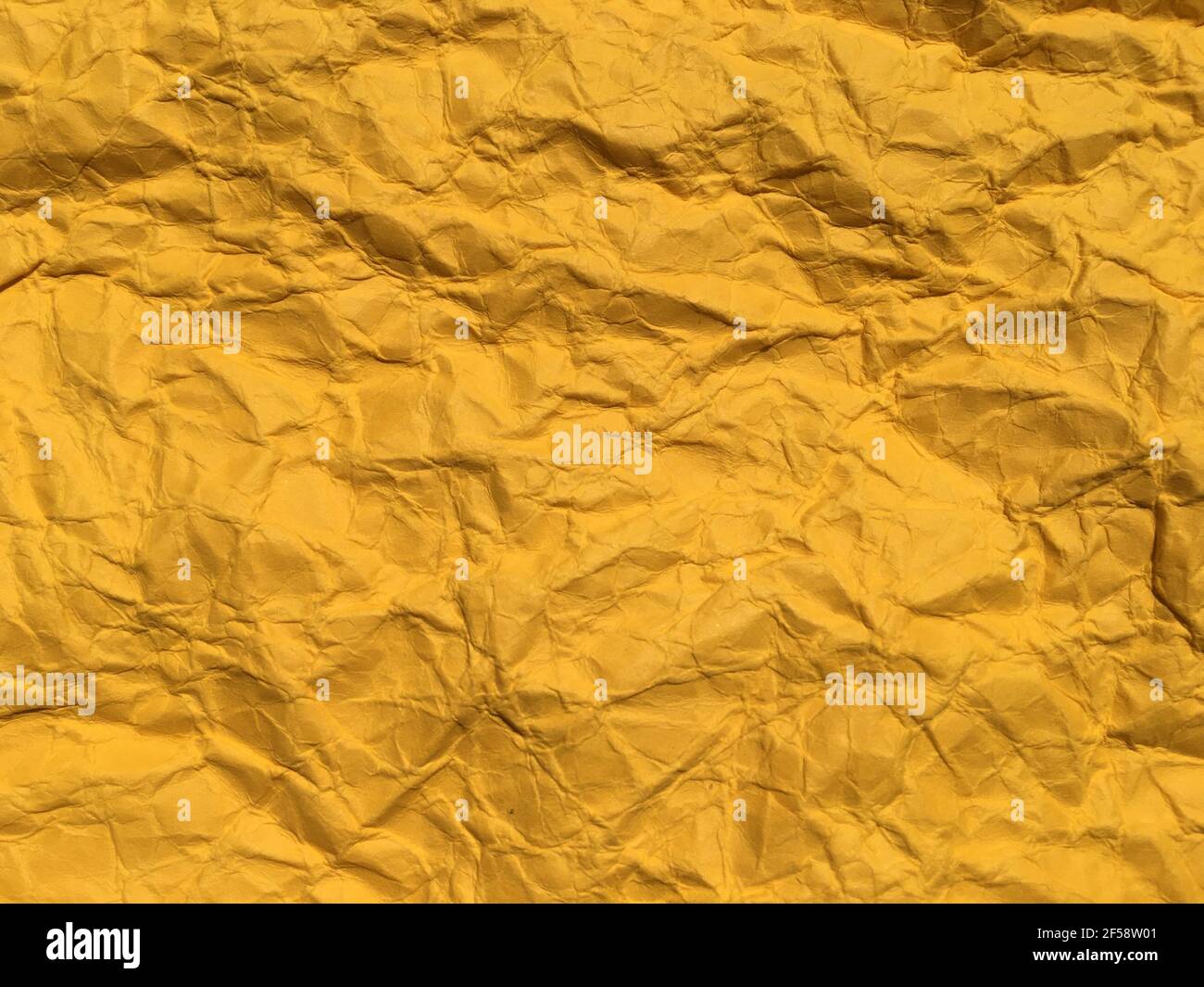 Yellow wrinkled paper background for Design. Copy space for text or ...