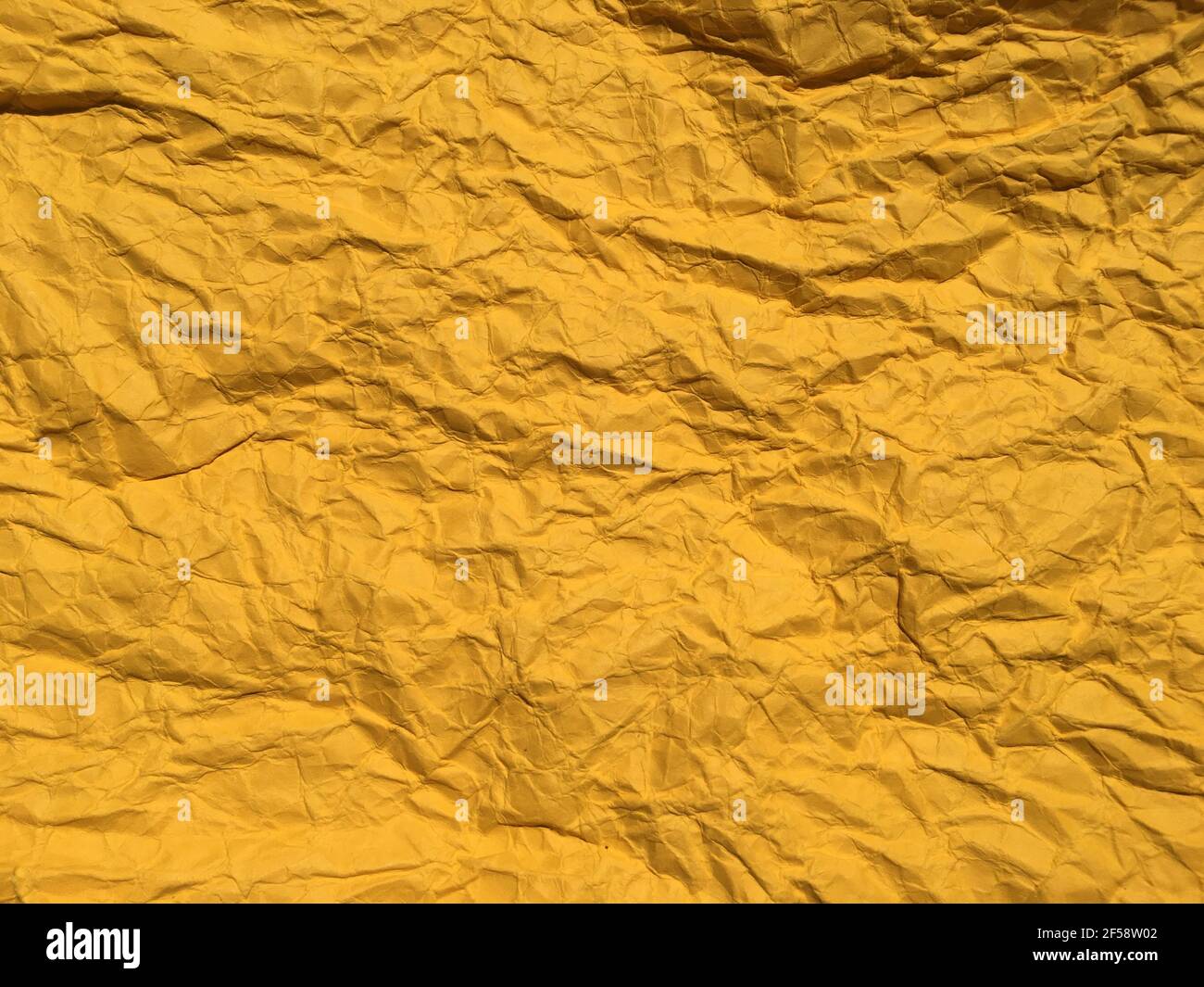 Yellow wrinkled paper background for Design. Copy space for text or ...