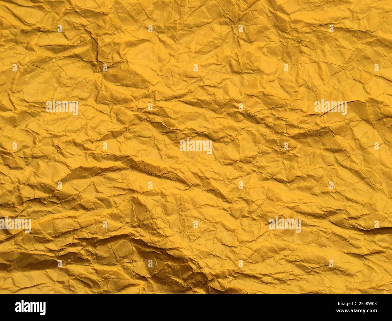 Yellow wrinkled paper background for Design. Copy space for text or ...