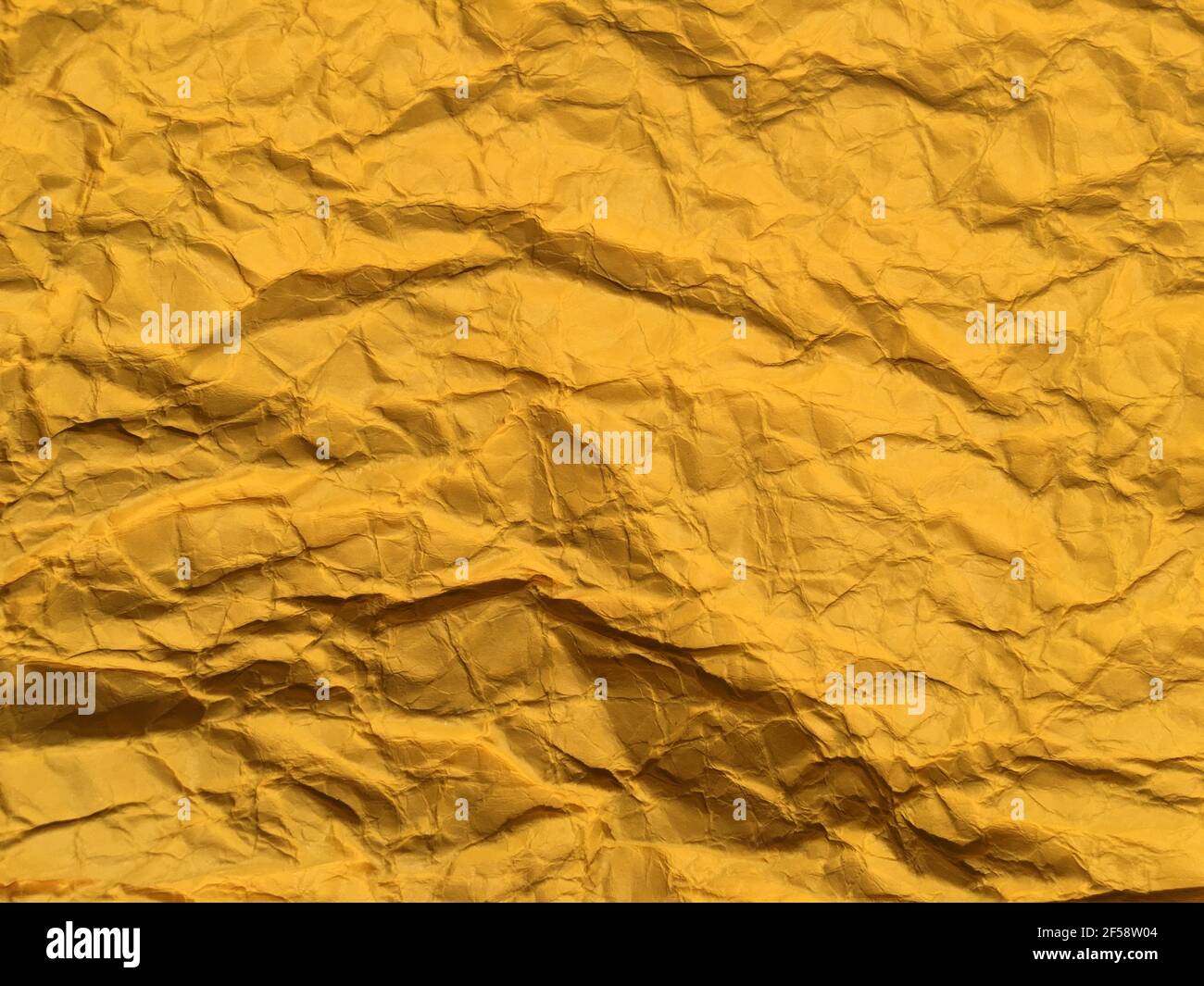 Yellow wrinkled paper background for Design. Copy space for text or ...