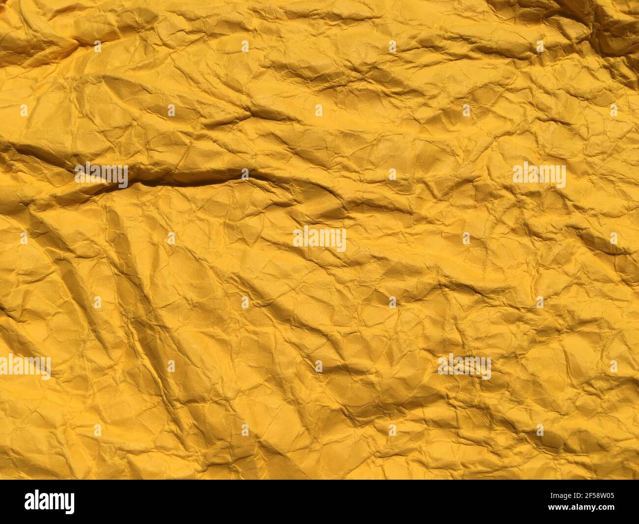 Yellow wrinkled paper background for Design. Copy space for text or ...