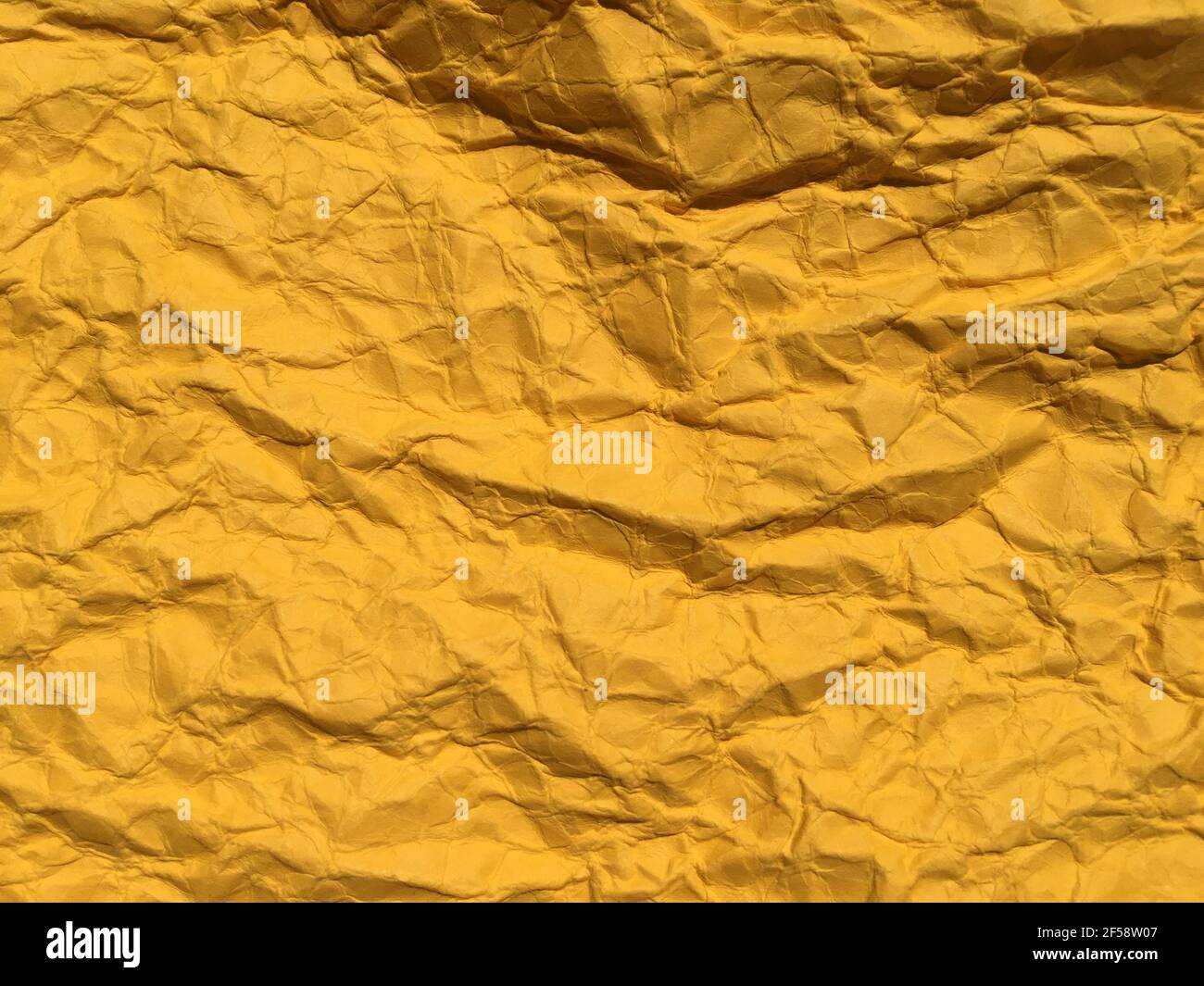 Yellow wrinkled paper background for Design. Copy space for text or ...