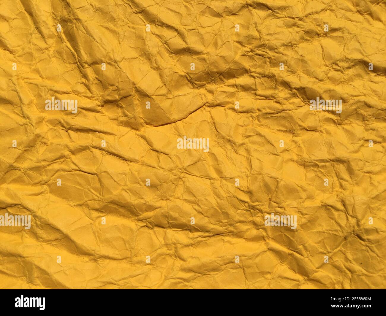 Yellow wrinkled paper background for Design. Copy space for text or ...