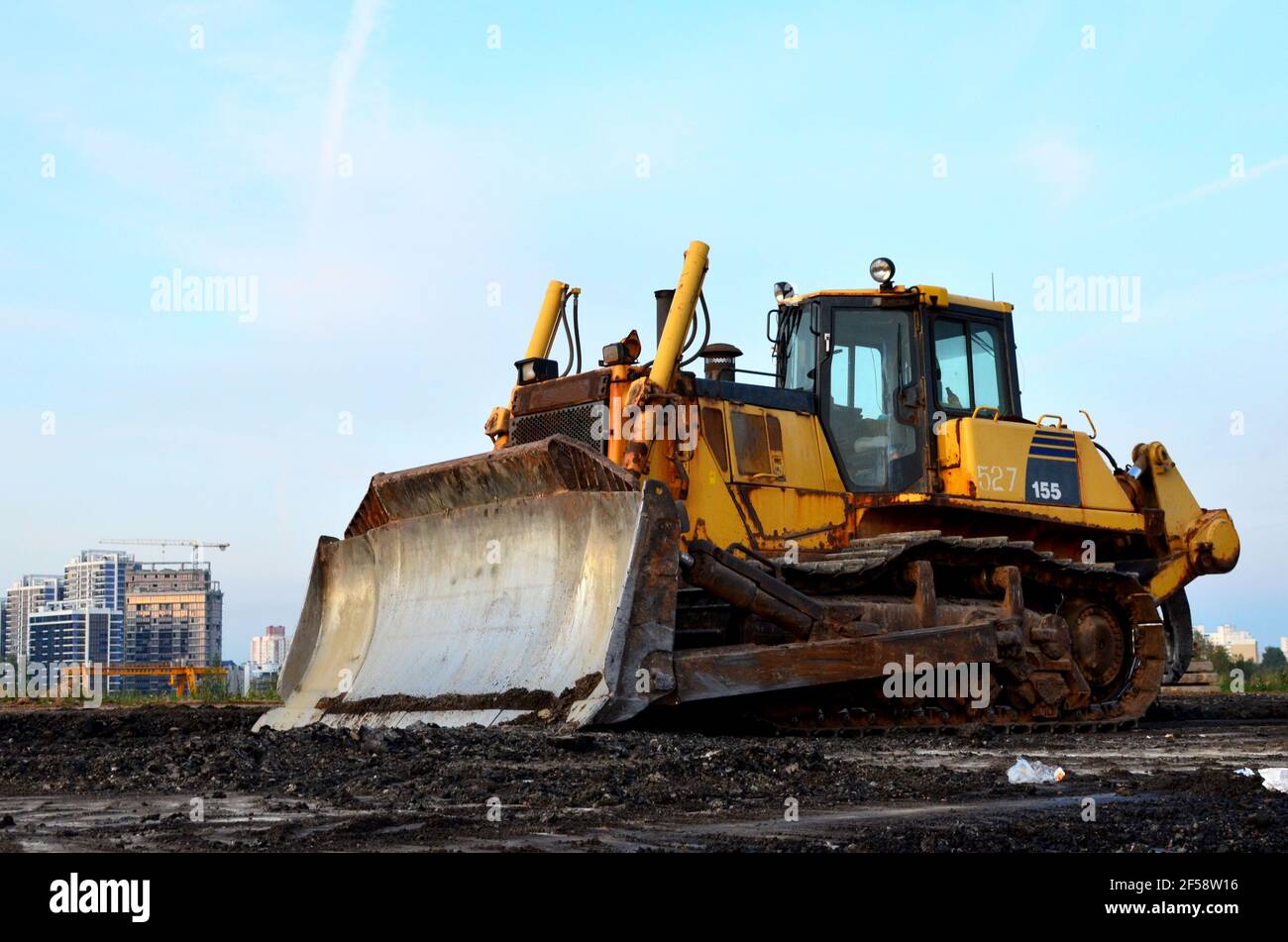 Bulldozer at construction site. Heavy equipment for digging, demolition ...