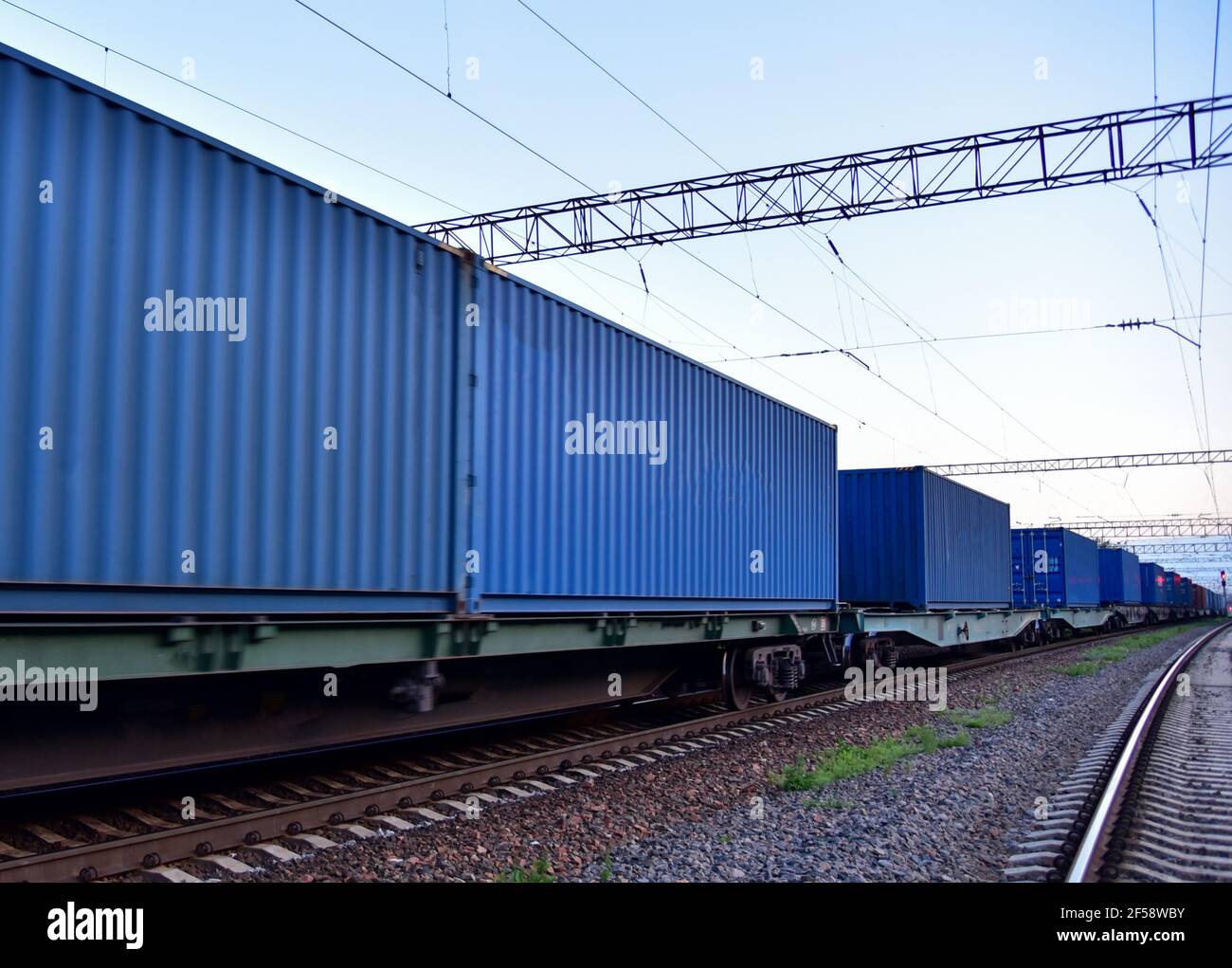 Cargo Containers Transportation On Freight Train By Railway. Intermodal ...