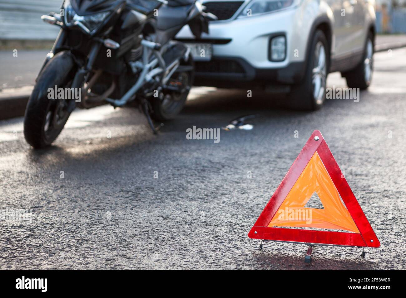 Rear-end collision on a road, a suv car hits a motorcycle, emergency ...