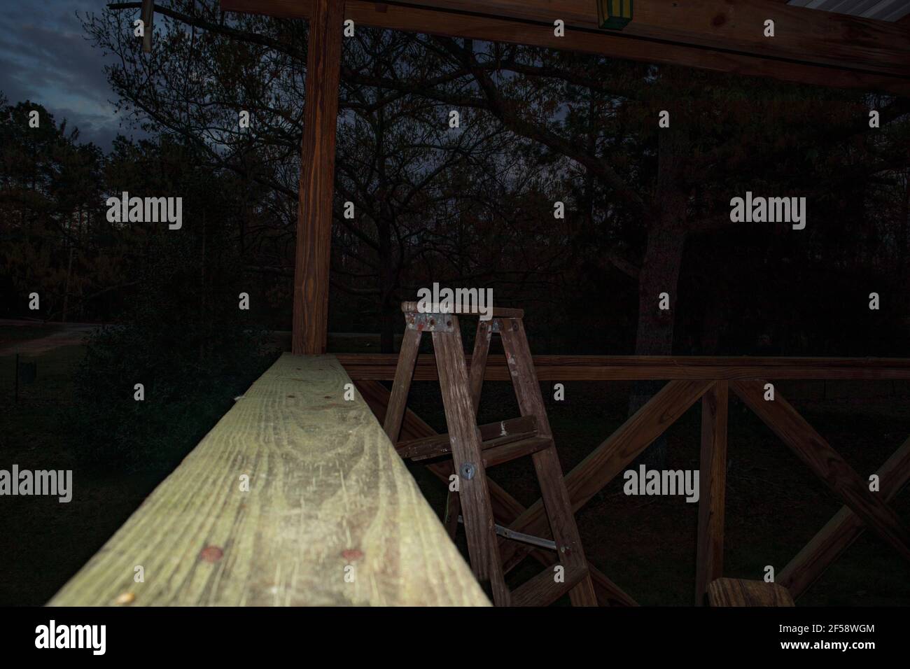 Wooden edge of a wooden porch and wooden ladder in rural Georgia Stock ...