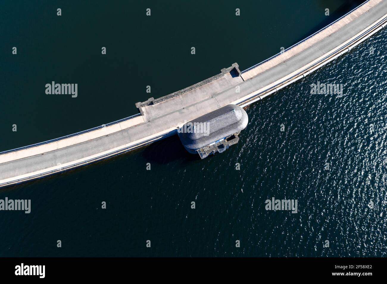 a dam structure dividing two lakes from above Stock Photo - Alamy
