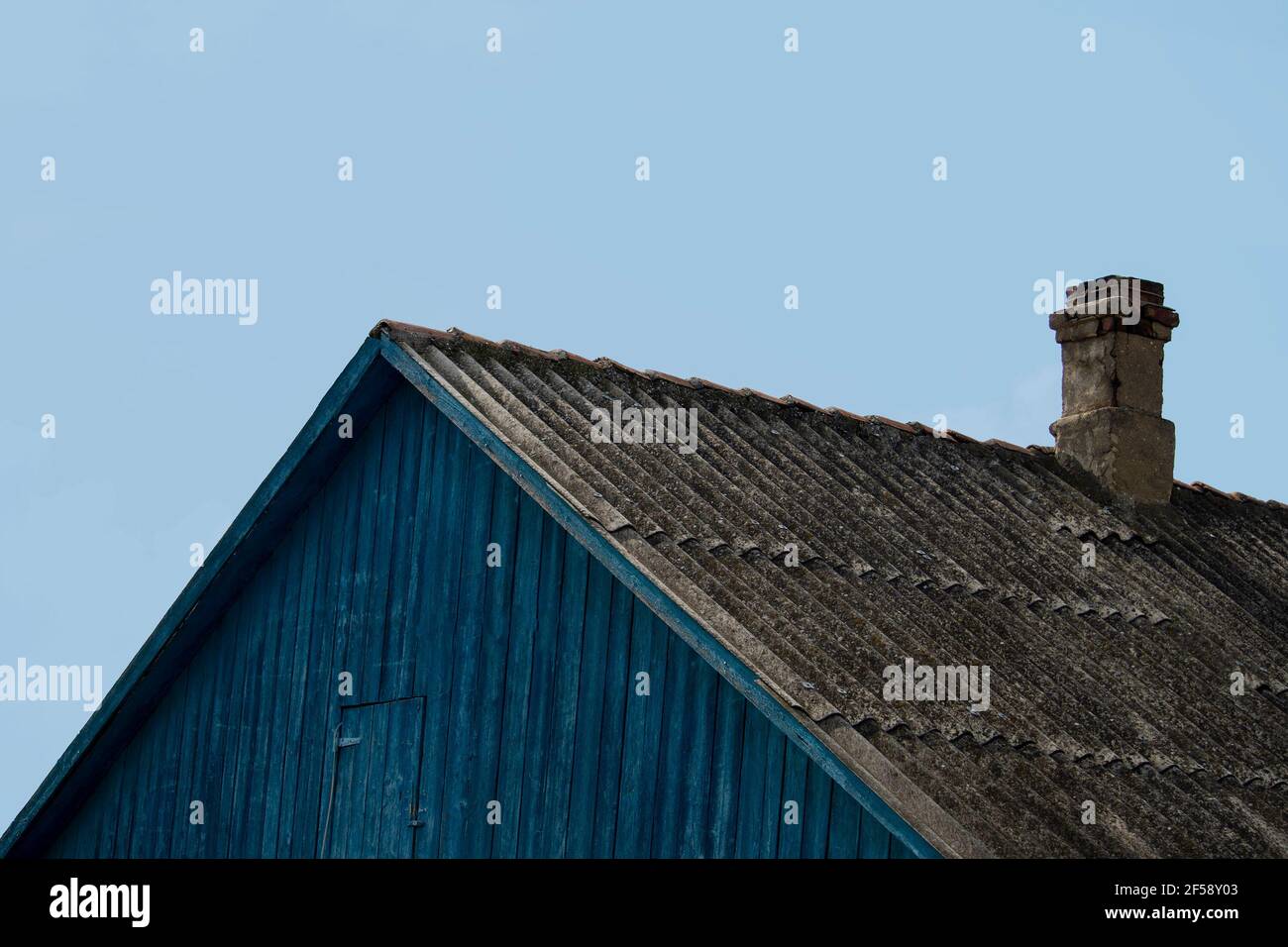 The roof with the pipe on the old house Stock Photo - Alamy