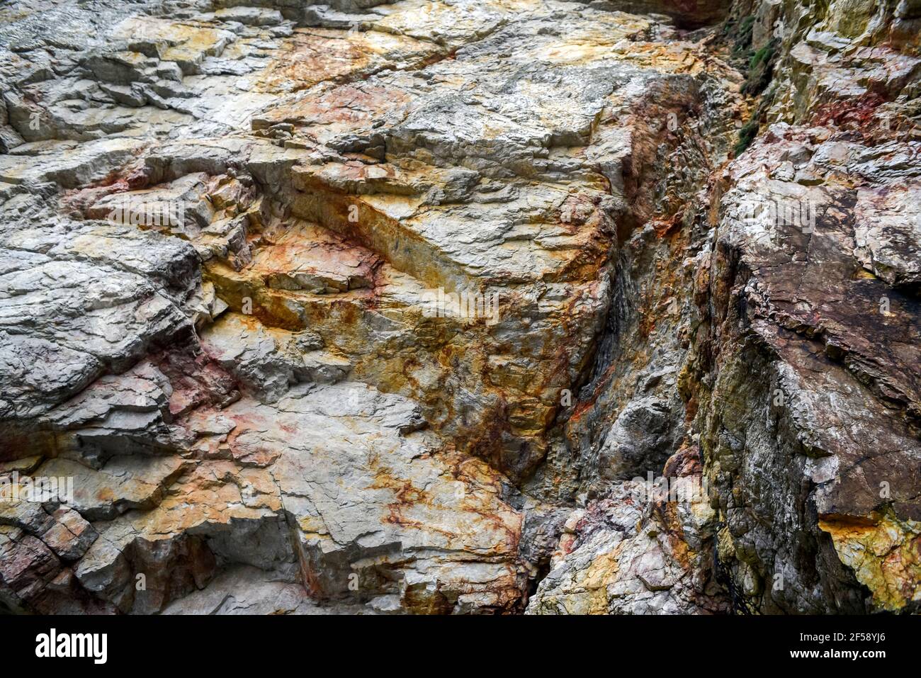 Colorful rock rock texture, geological phenomenon in the rocks above ...