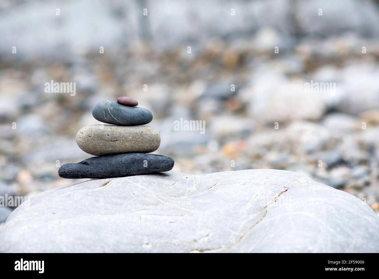 A background of pebbles by the ocean on the beach with copy space, a ...