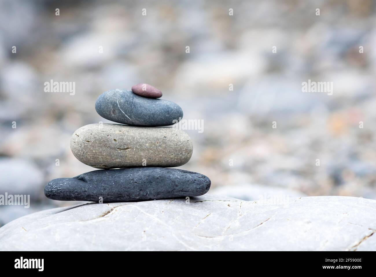 A background of pebbles by the ocean on the beach with copy space, a ...