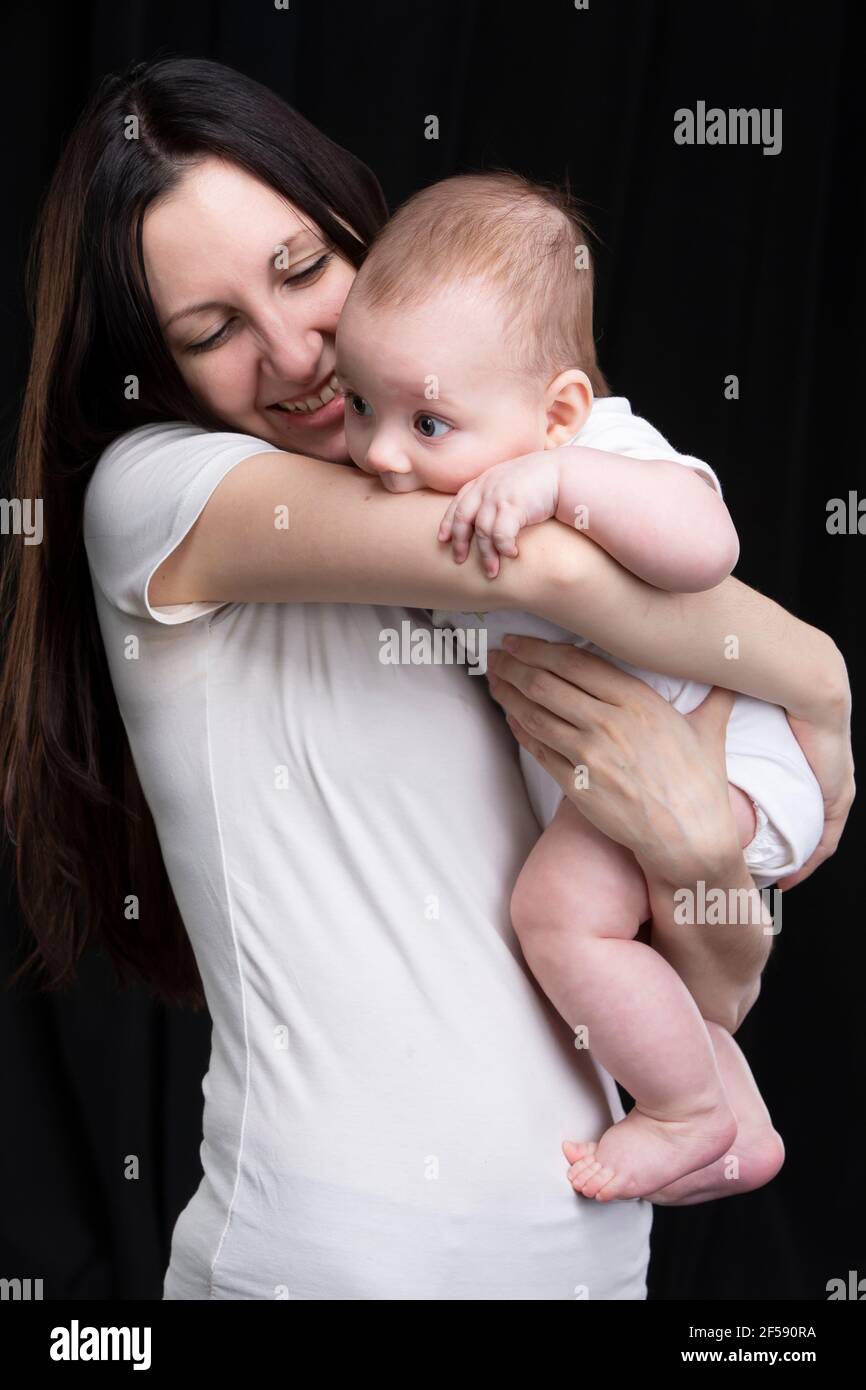 Mother hugs son black hi-res stock photography and images - Alamy