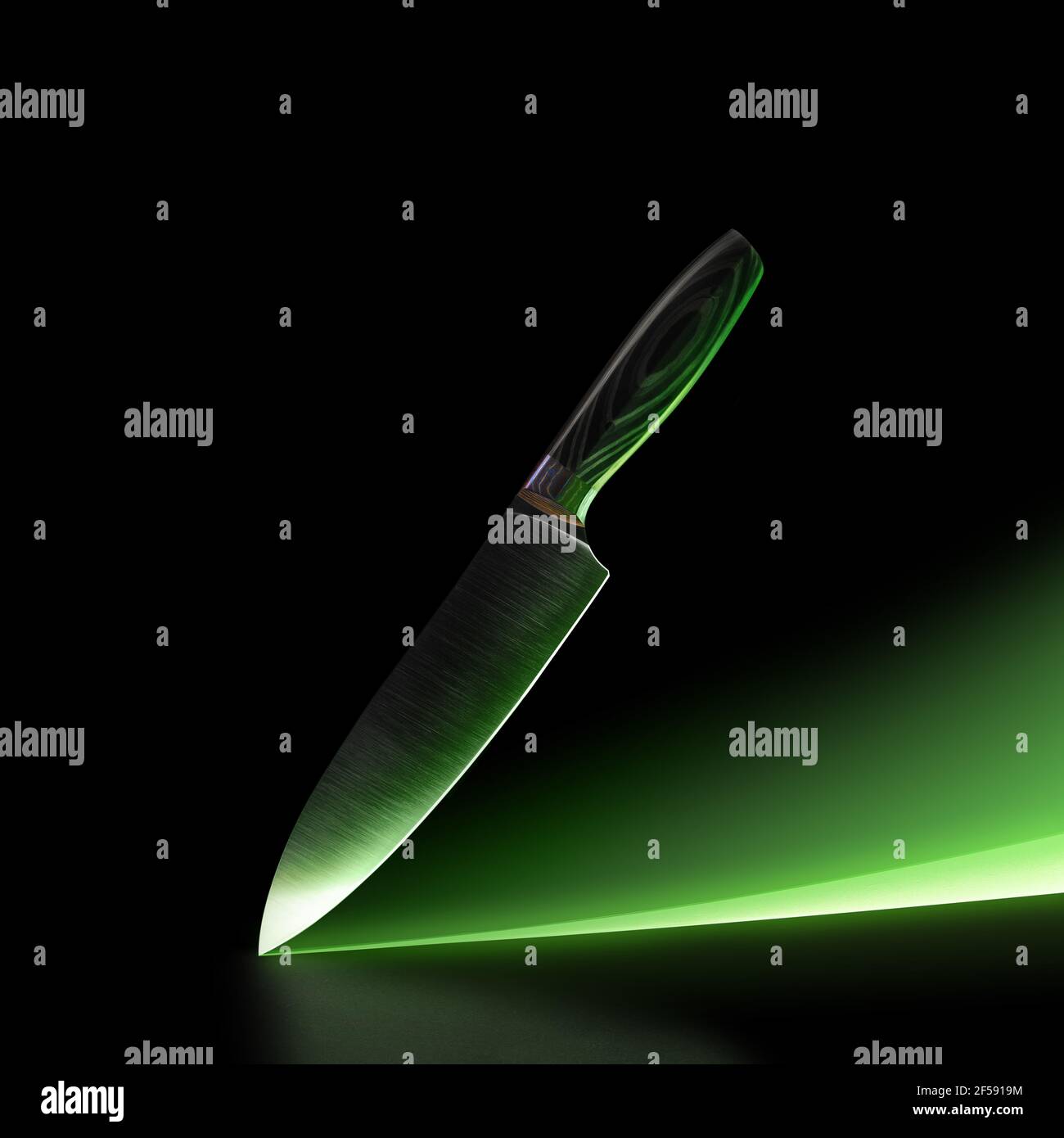 Chef s knife isolated on black studio background with green neon path ...