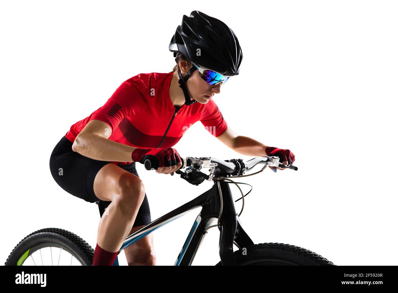 Close up professional female cyclist on road bike isolated over white ...