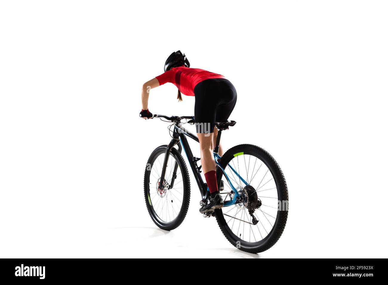 Professional cycling athlete with road bike isolated over white ...
