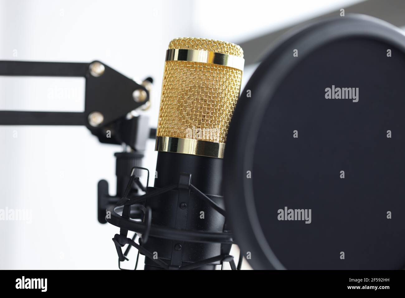 Closeup of golden microphone in recording studio Stock Photo - Alamy