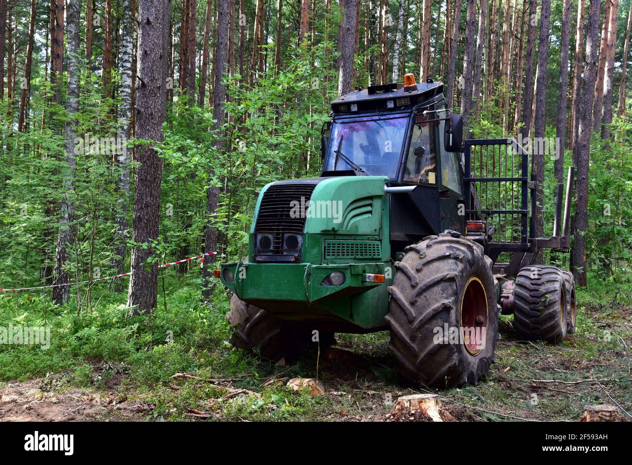 Crane forwarder machine at during clearing of a plantation. Wheeled ...