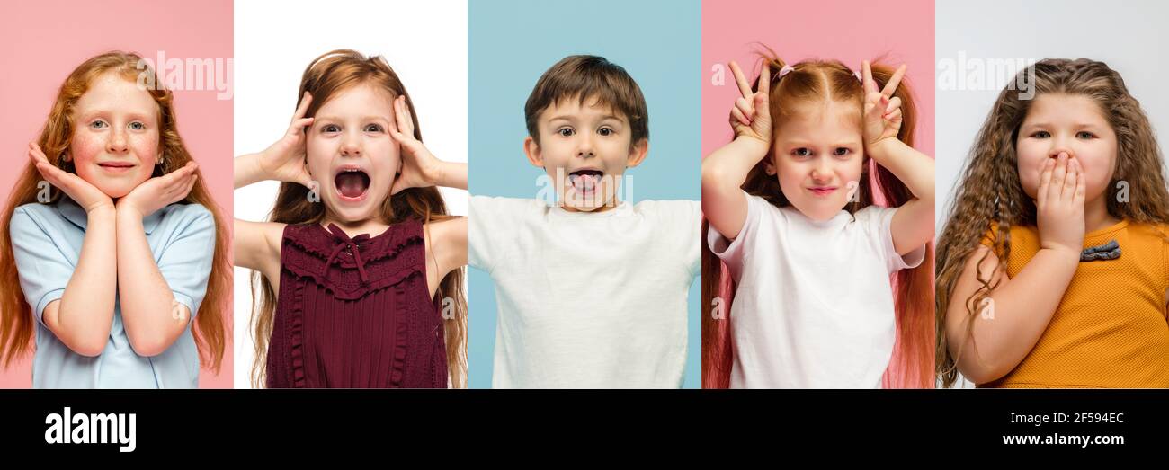 Young and happy kids gesturing isolated on multicolored studio ...