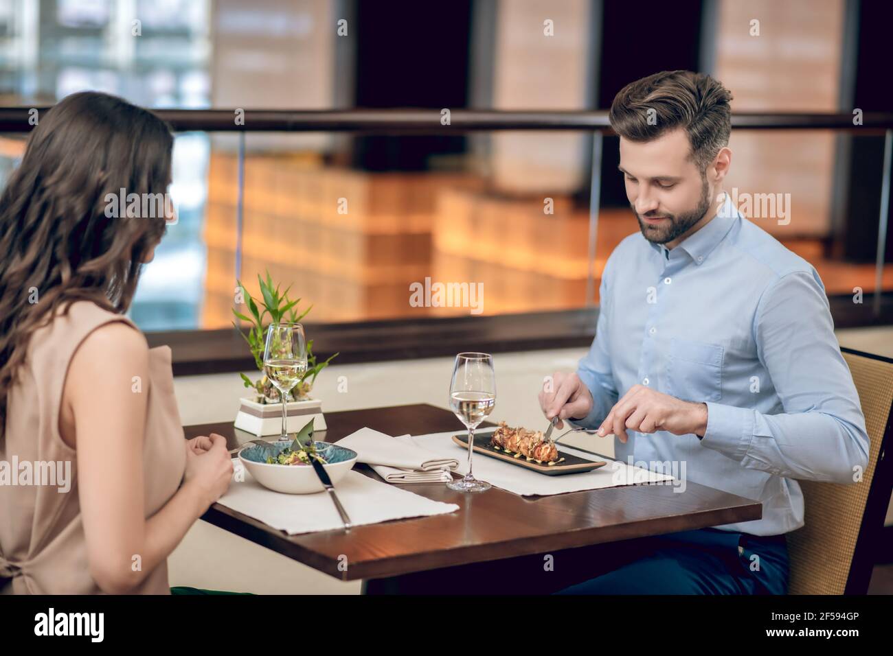 Man woman sitting opposite other hi-res stock photography and images ...