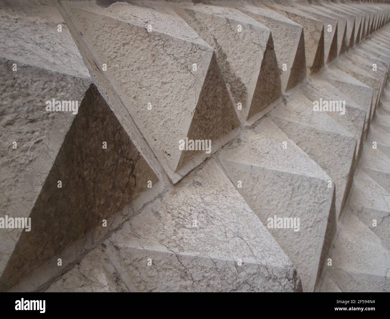 Pyramid concrete wall pattern Stock Photo - Alamy