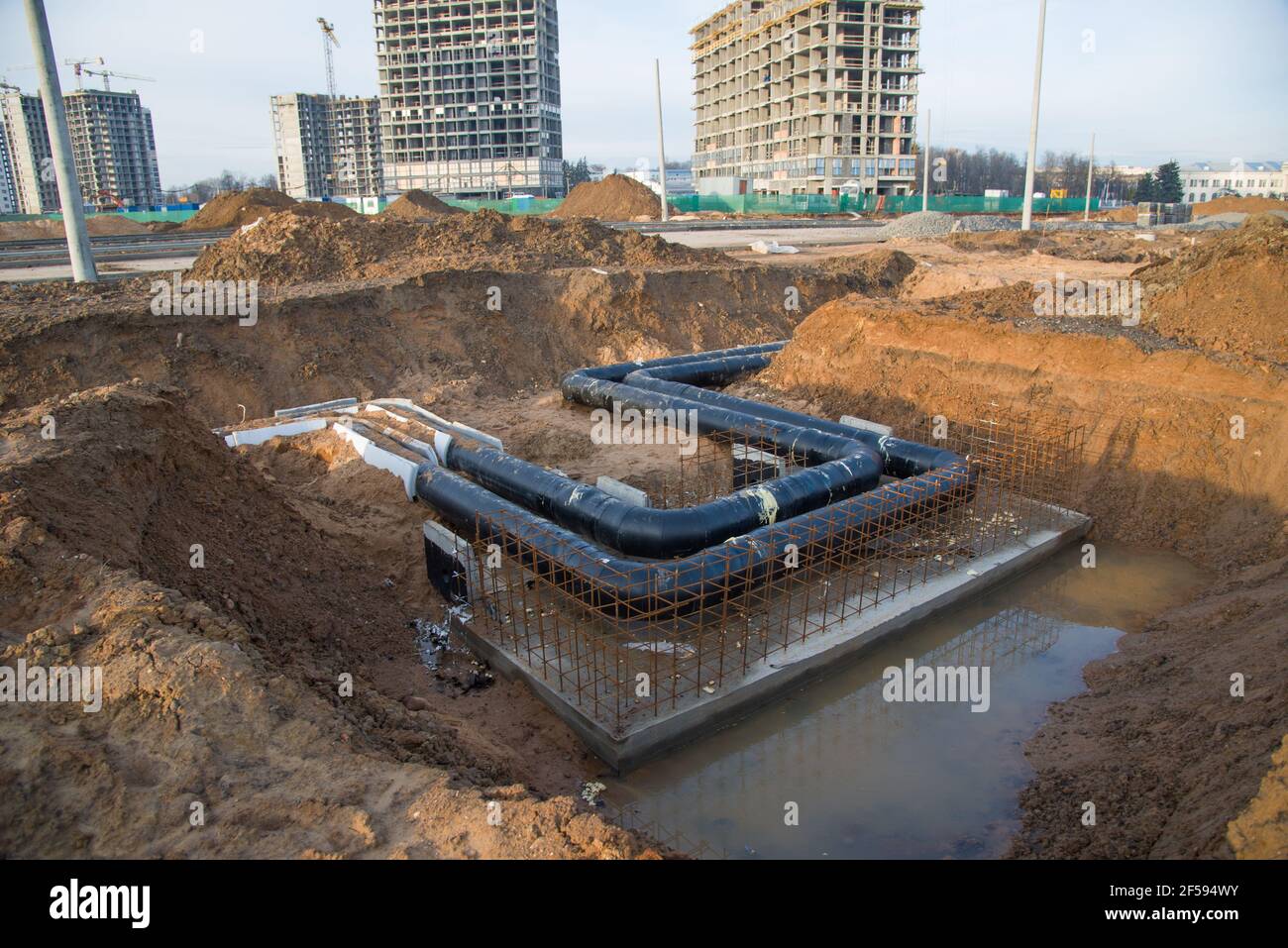 Laying of underground storm sewer pipes in ditch. Installation of water ...