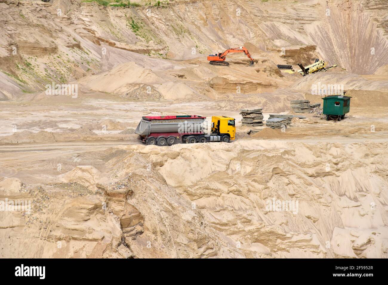 Truck with tipper semi trailer transported sand from the quarry. Dump ...