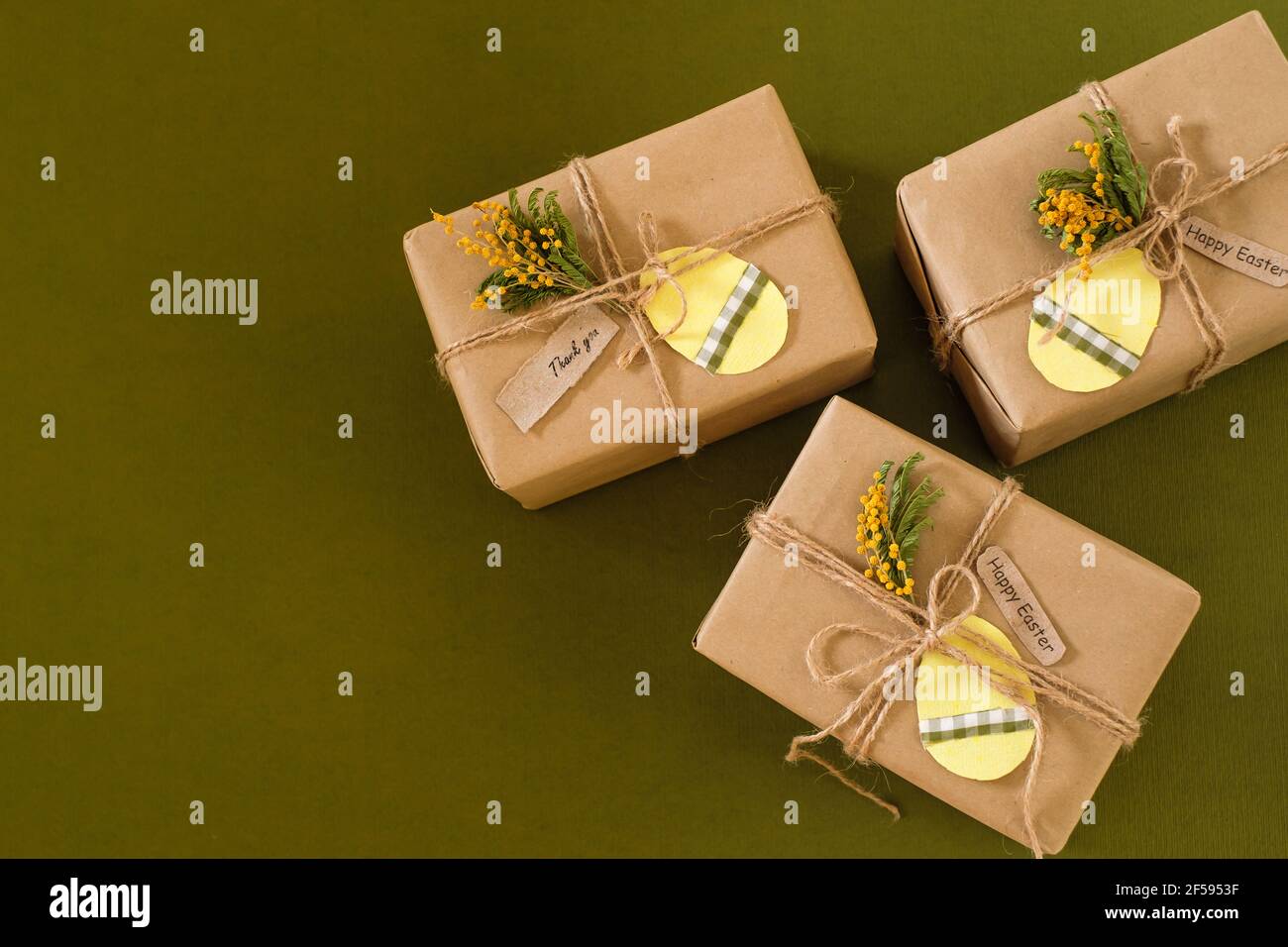 Easter flat lay zero waste, gift boxes with an egg-shaped tag and ...