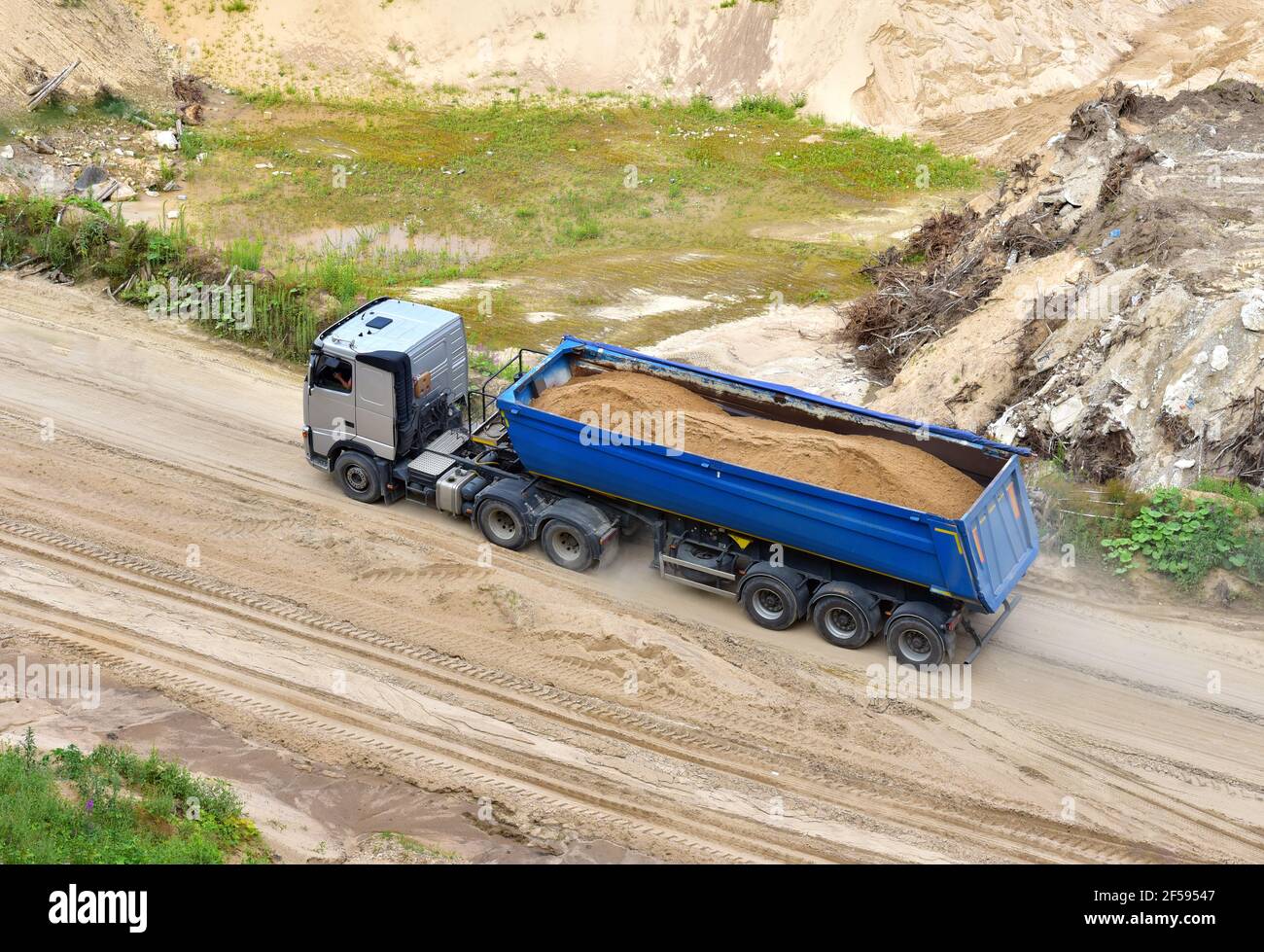 Truck with tipper semi trailer transported sand from the quarry. Dump ...