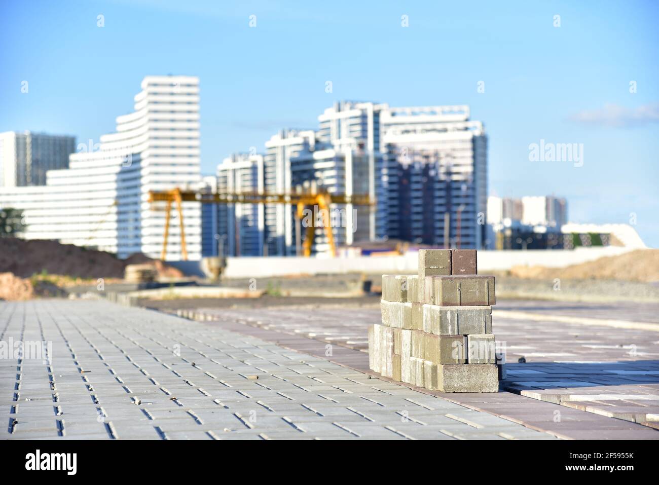 Process of installing paving bricks at construction site. Laying paving ...