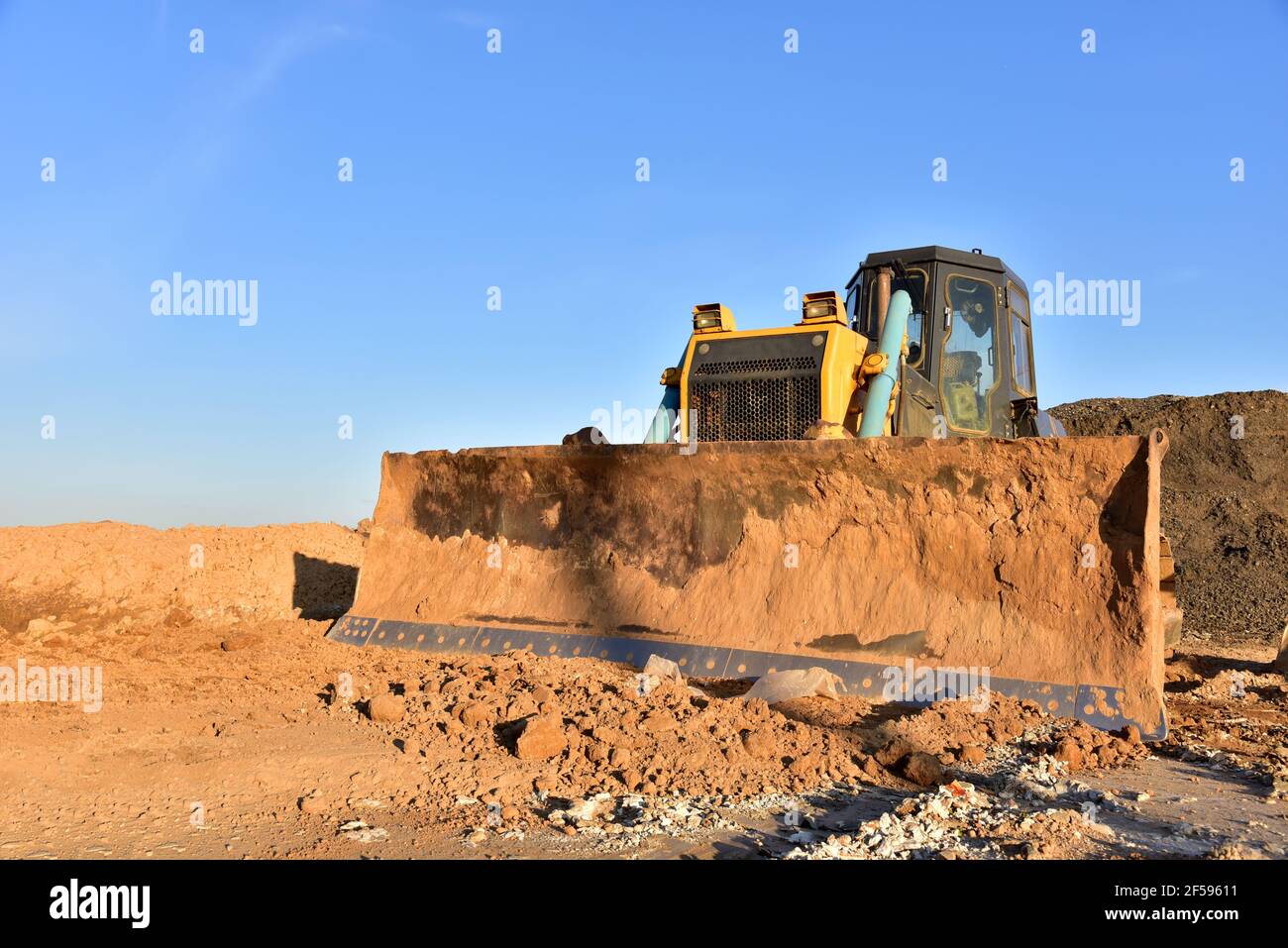 Dozer working at construction site. Bulldozer for land clearing ...