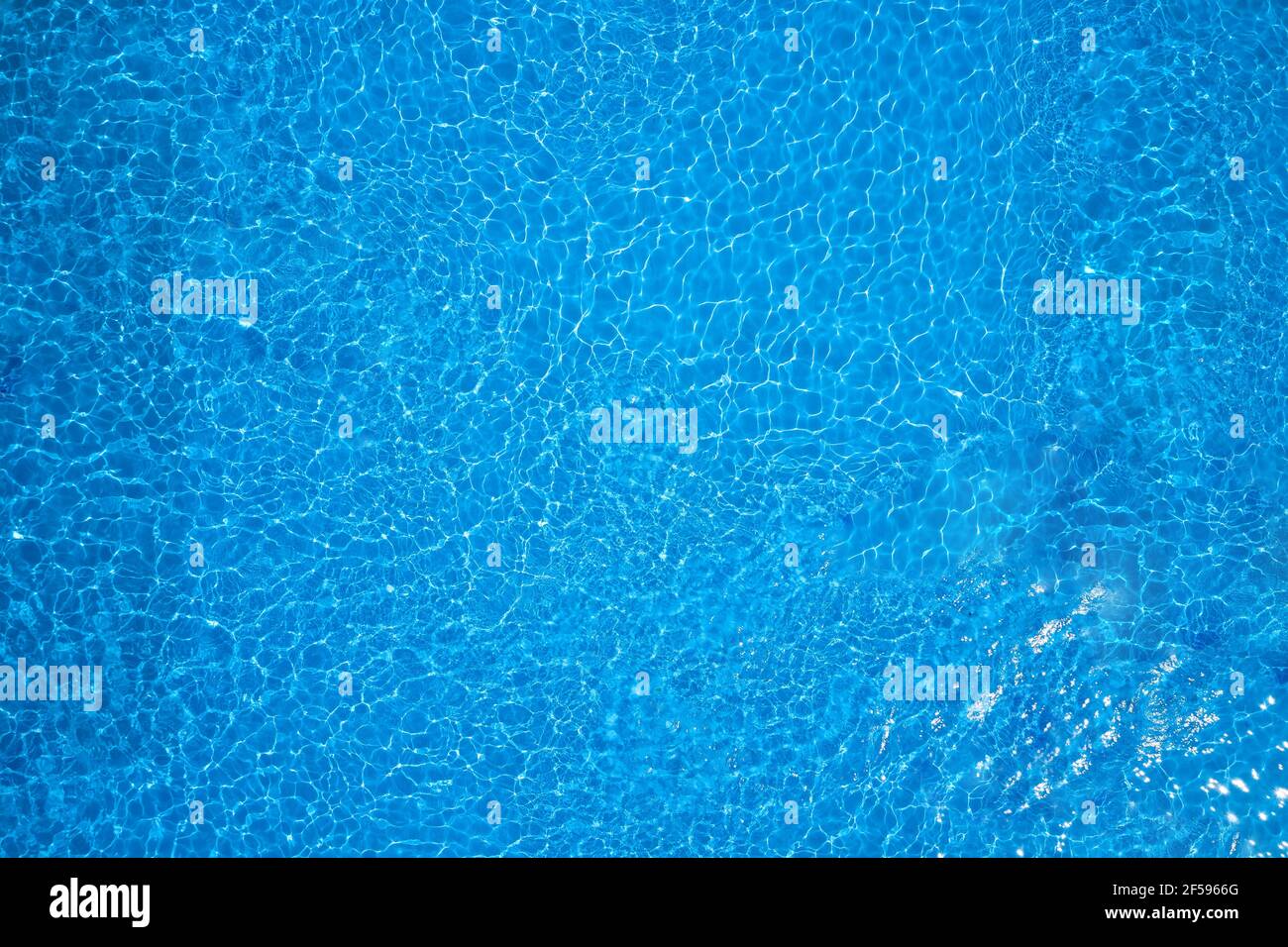 Clear blue swimming pool water Stock Photo - Alamy