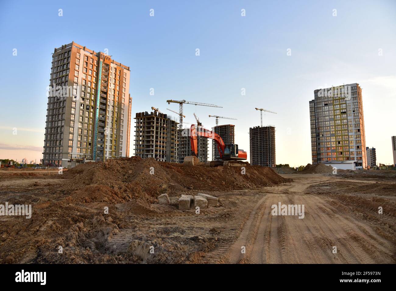 Excavator on earthmoving at construction site. Road work and Dig pit ...