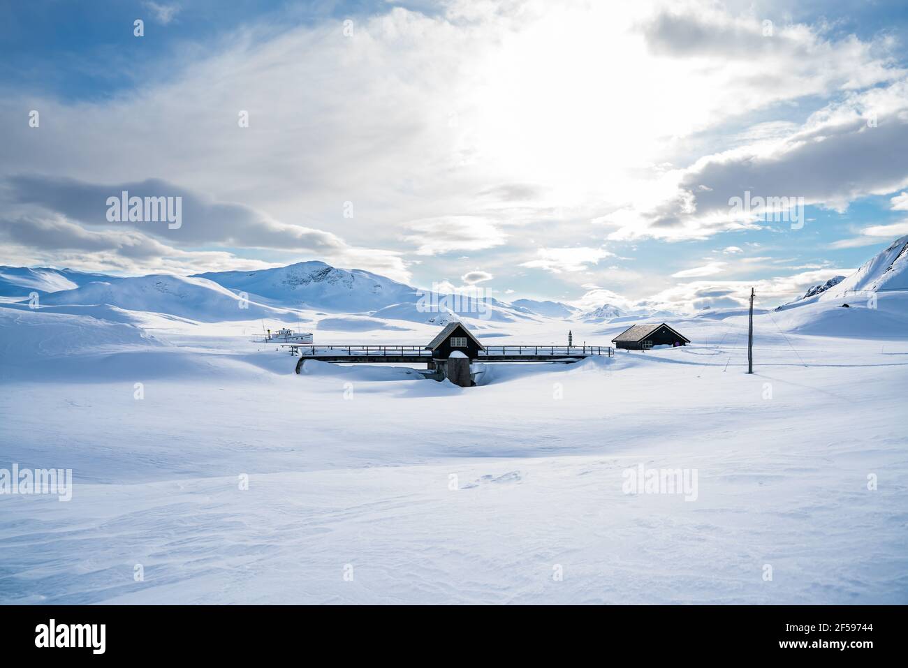 Hydro electric dam in the mountains covered in snow and ice Stock Photo ...