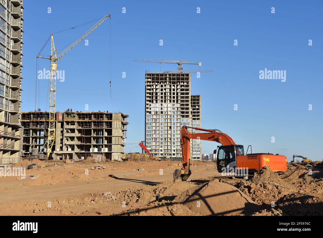 Excavator Working On Road Construction. Backhoe on Earthworks. Heavy ...