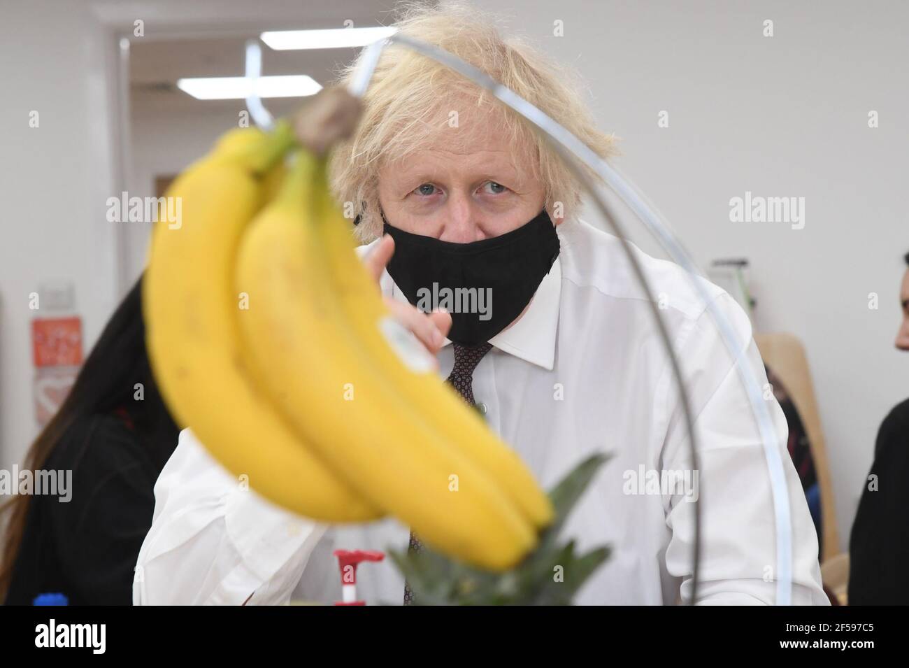 Prime Minister Boris Johnson drawing a bunch of bananas during a visit ...