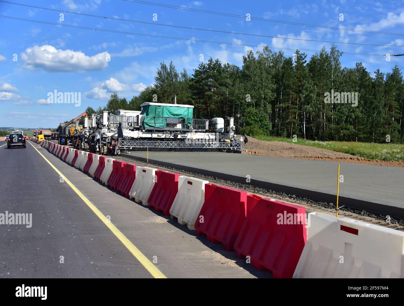 Slip Form Concrete Paver Machine on construction highway. Building ...