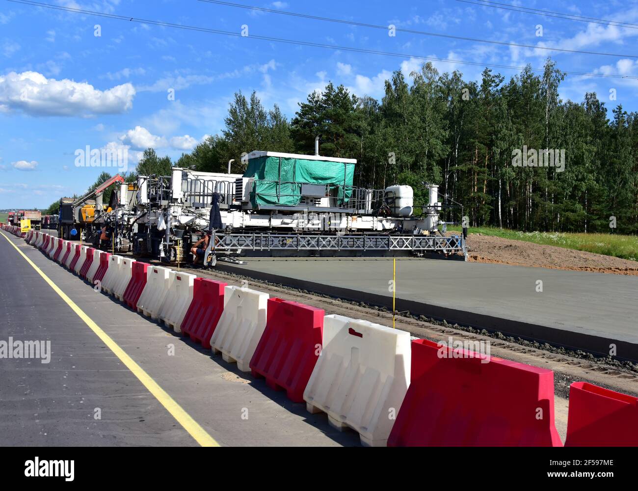 Slip Form Concrete Paver Machine on construction highway. Building ...