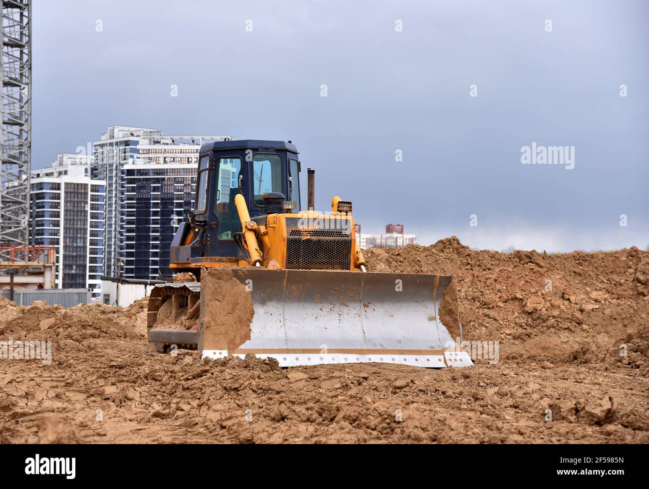 Dozer in action at construction site. Bulldozer for land clearing ...