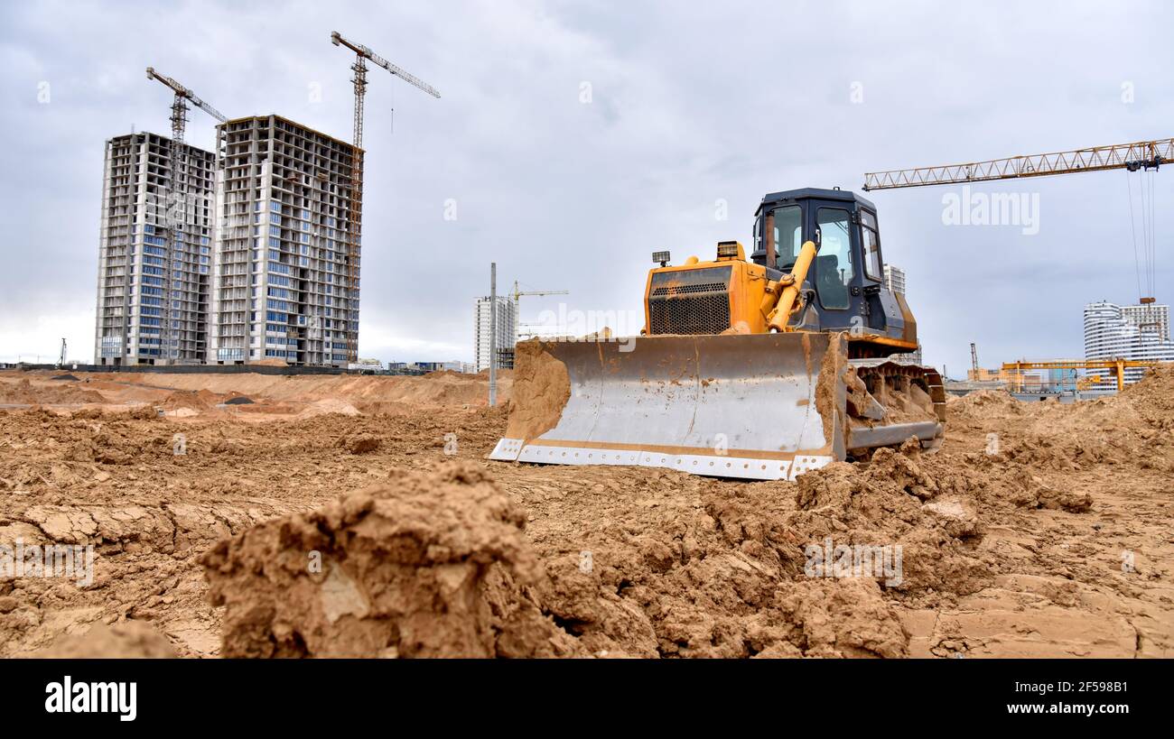 Dozer in action at construction site. Bulldozer for land clearing ...