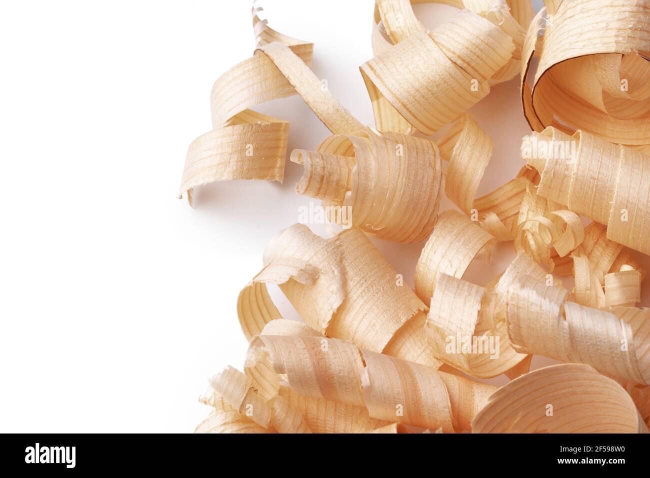 Wood shavings isolated on white background Stock Photo - Alamy