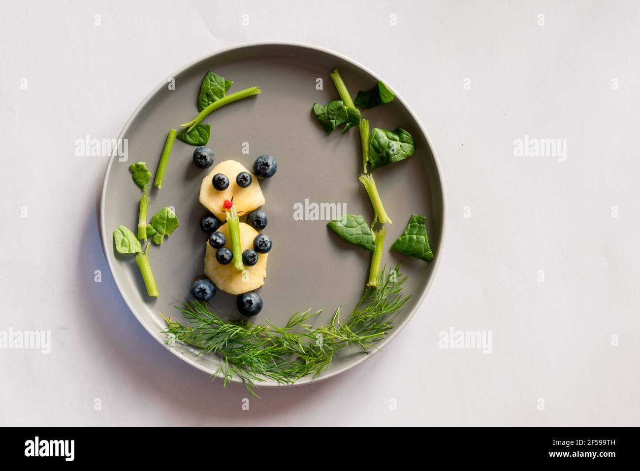 Panda eating fruit hi-res stock photography and images - Alamy
