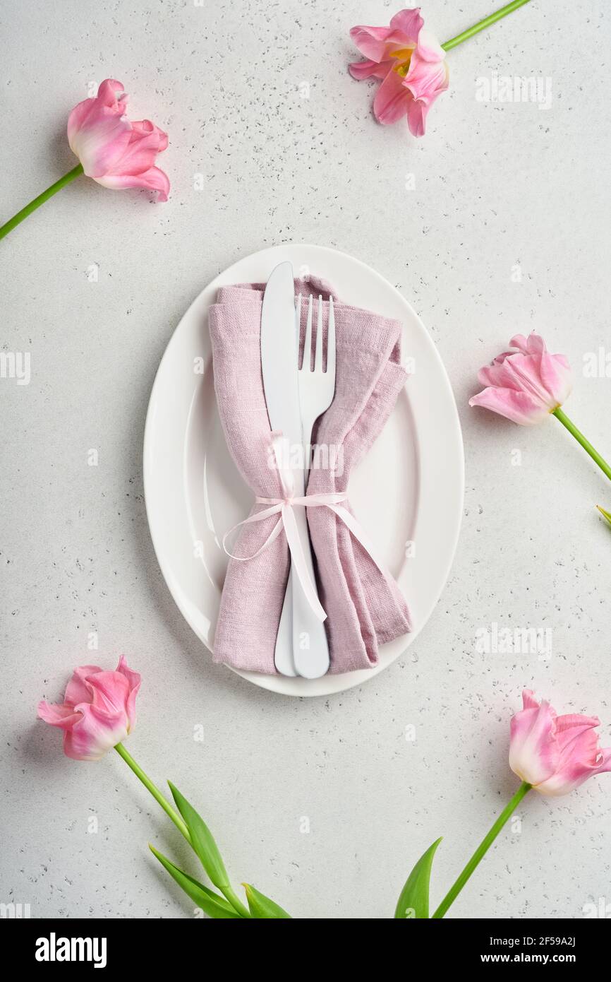 Easter table setting with floral decor on gray table. Elegance dinner ...