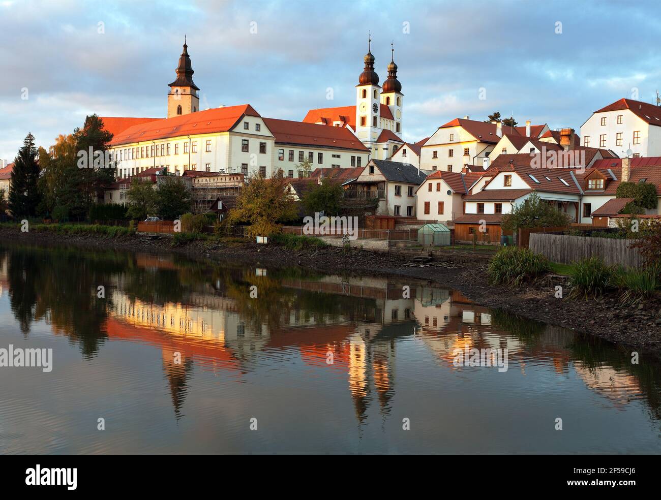 Evening view of Telc or Teltsch town mirroring in lake, World heritage ...
